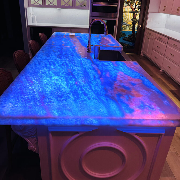 Backlit quartzite island kitchen in Miami Beach - lumiron